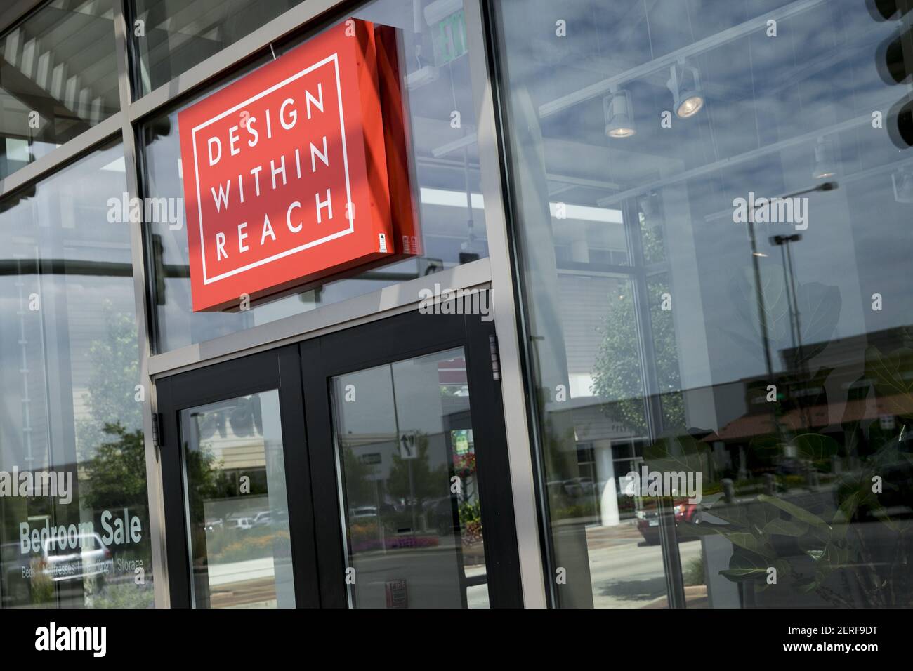 A logo sign outside of a Design Within Reach retail store location in ...