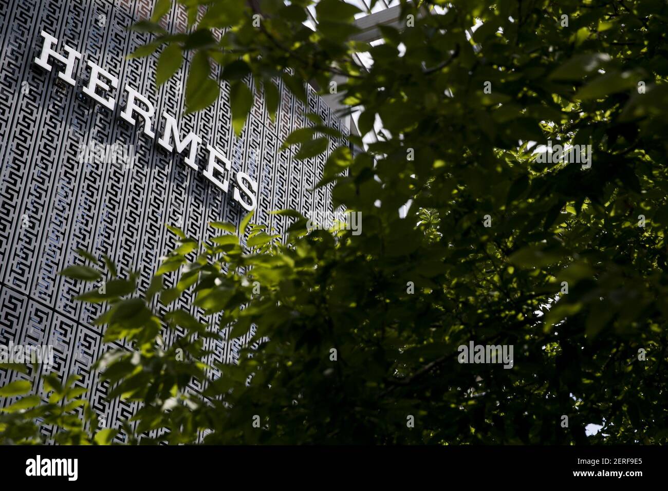 A logo sign outside of a Hermes retail store location in Denver ...