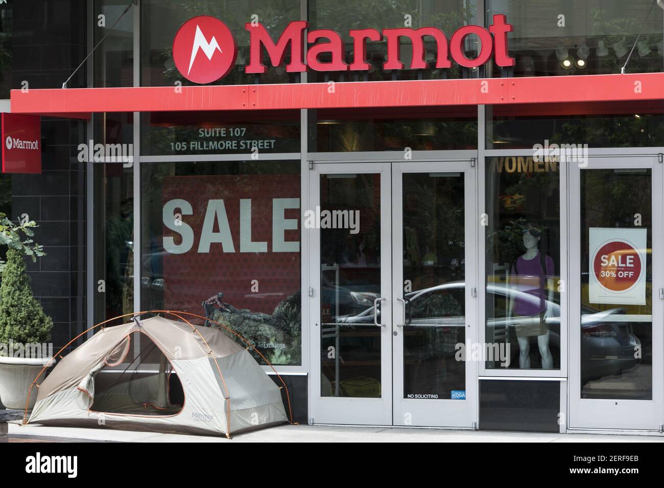 A logo sign outside of a Marmot Mountain retail store location in ...