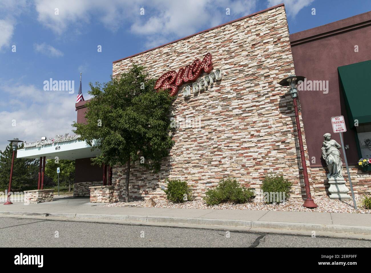 A logo sign outside of a Buca di Beppo restaurant location in ...