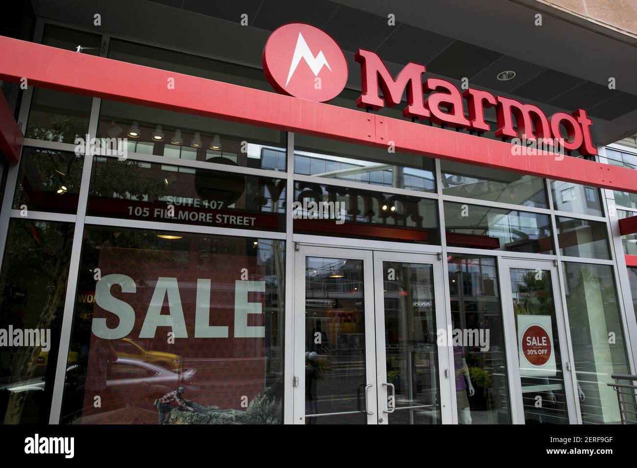 A logo sign outside of a Marmot Mountain retail store location in ...