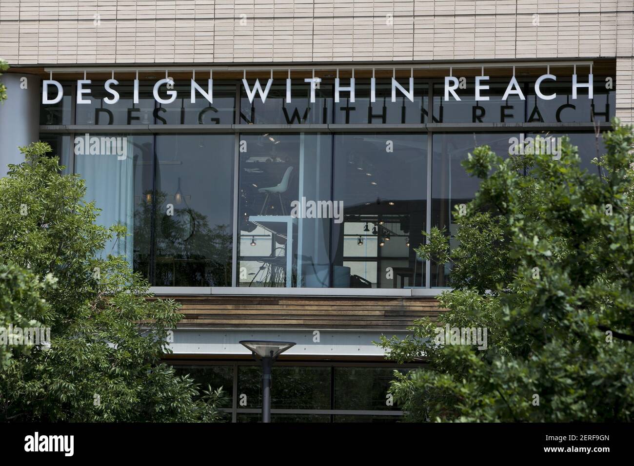 A logo sign outside of a Design Within Reach retail store location in ...
