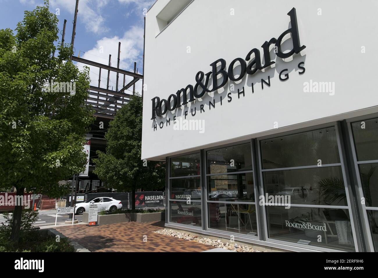A logo sign outside of a Room & Board retail store location in Denver ...