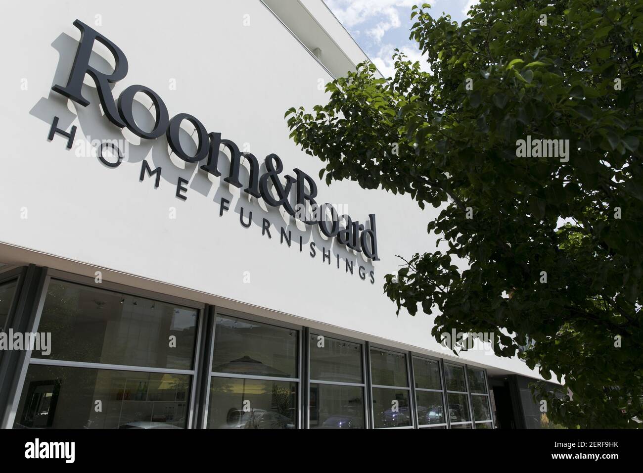 A logo sign outside of a Room & Board retail store location in Denver ...