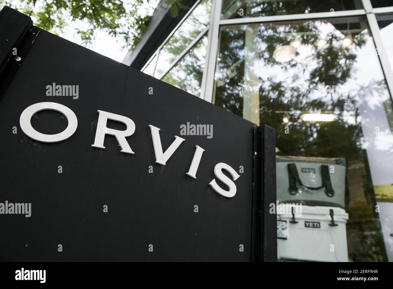 A logo sign outside of a Orvis retail store location in Denver ...