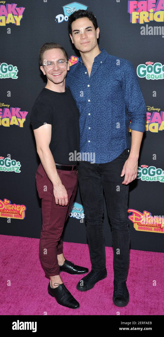 Actor Jason Gotay (R) attends the red carpet premiere of Freaky Friday ...