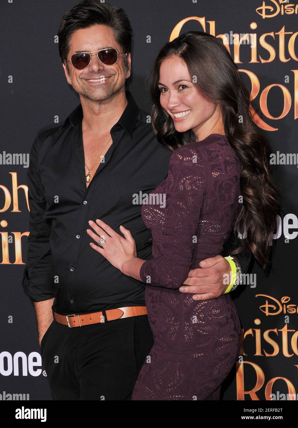 (L-R) John Stamos and Caitlin McHugh arrives at the Disney’s ...
