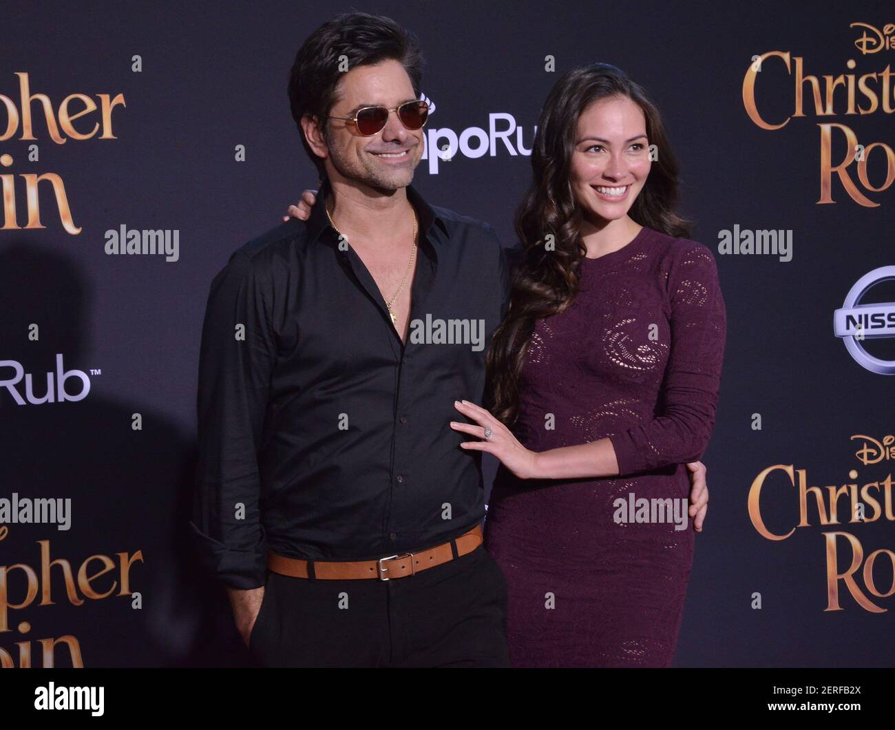 (L-R) John Stamos and Caitlin McHugh arrives at the Disney’s ...