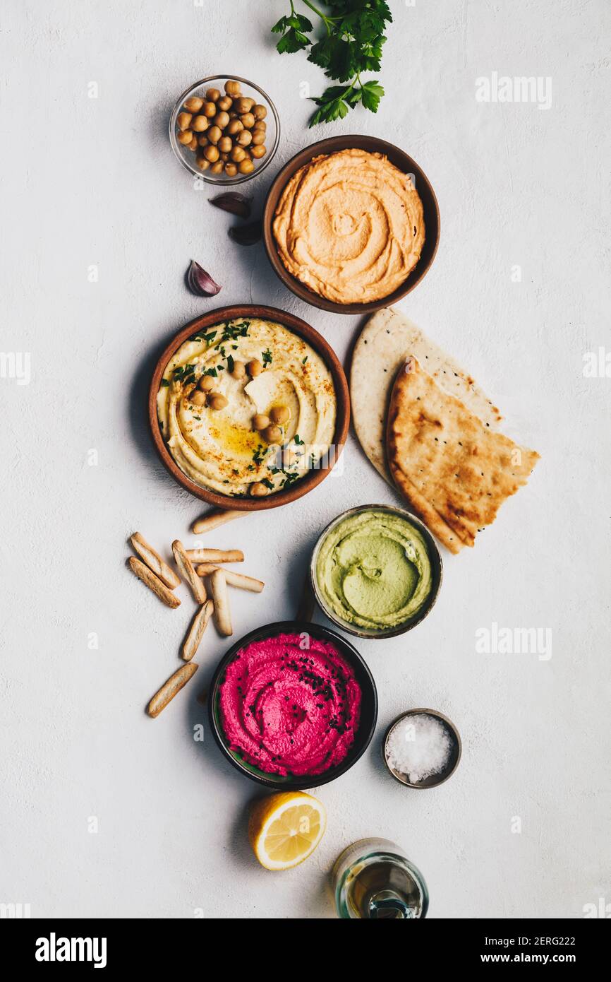 Flat-lay of Various Vegetarian dips hummus. Different kinds of dips ...