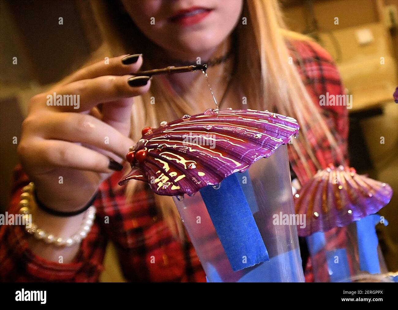 Long Island Mermaid Pod member Mary Grecco works in her home creating ...