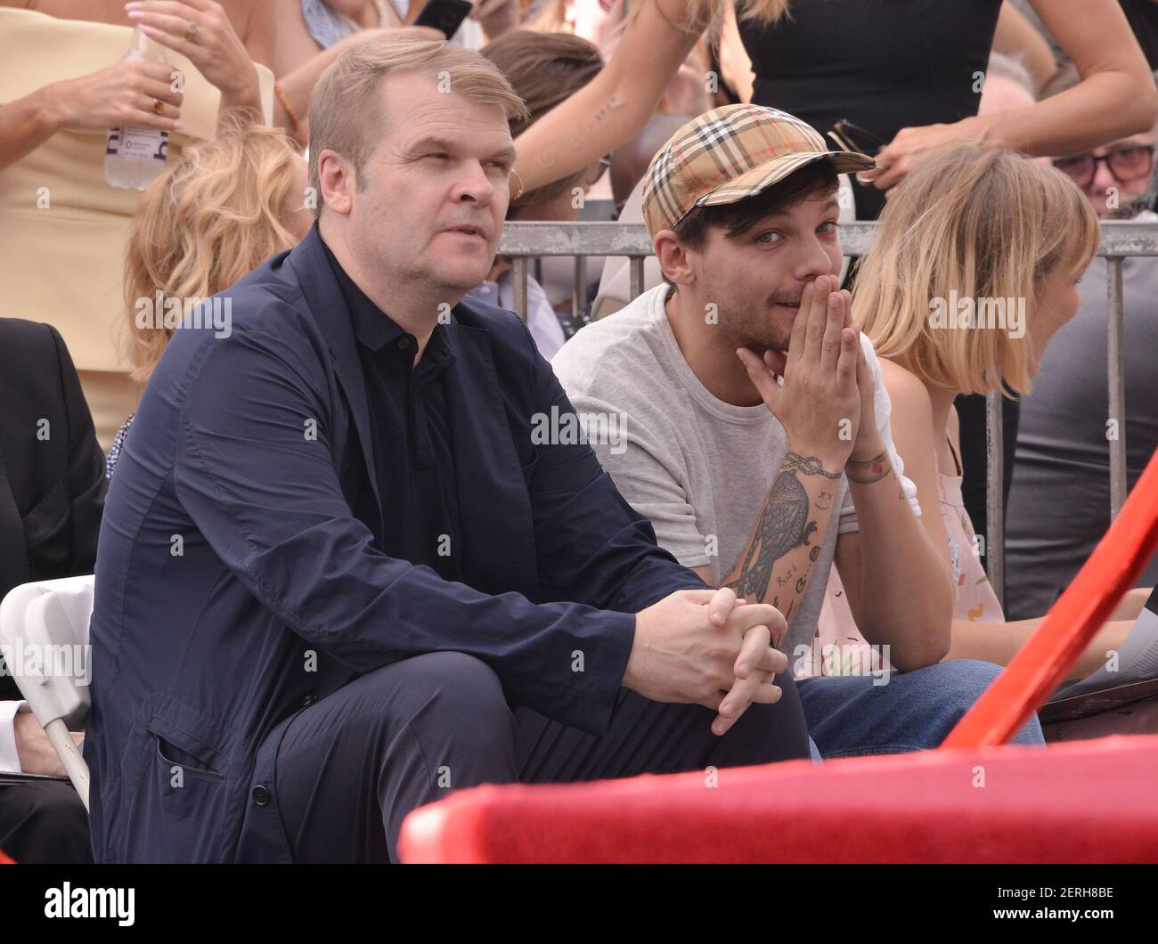 (L-R) Rob Stringer and Louis Tomlinson at the Simon Cowell Star On The ...