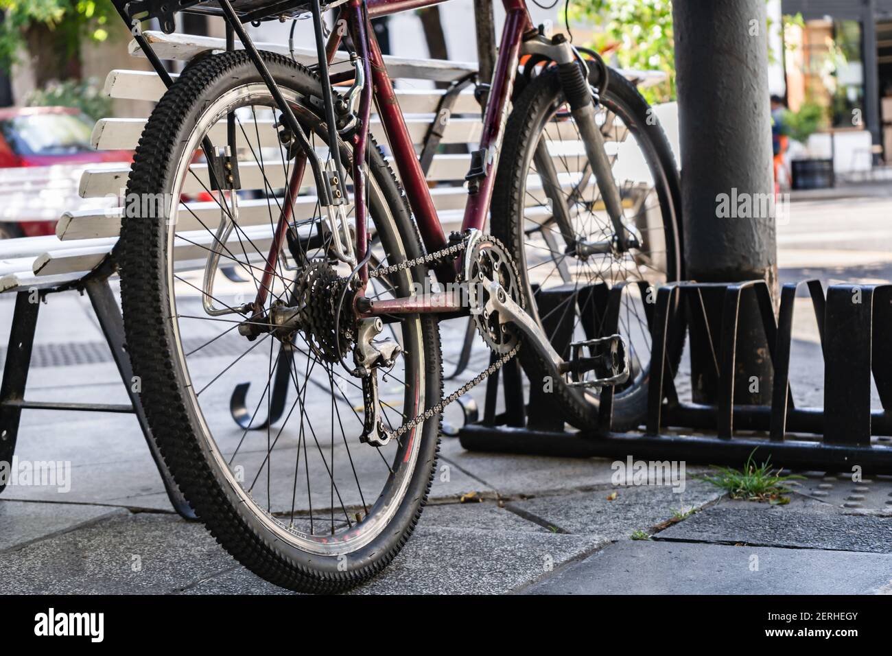 Bicycle parked in a bicycle rack in a corner Stock Photo - Alamy