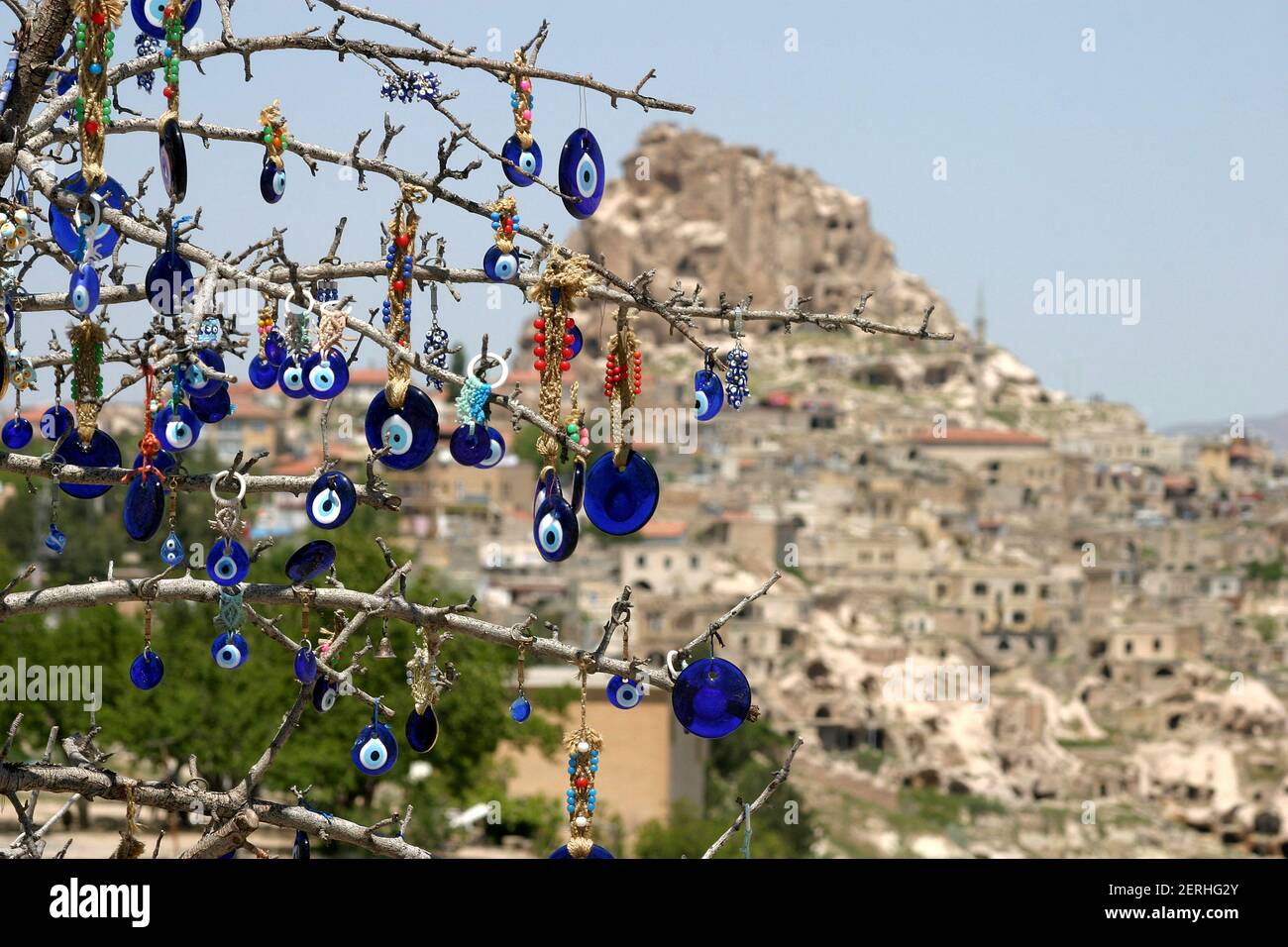 Evil eye in tree behind Uchisar Castle in Cappadocia, Nevsehir, Turkey ...