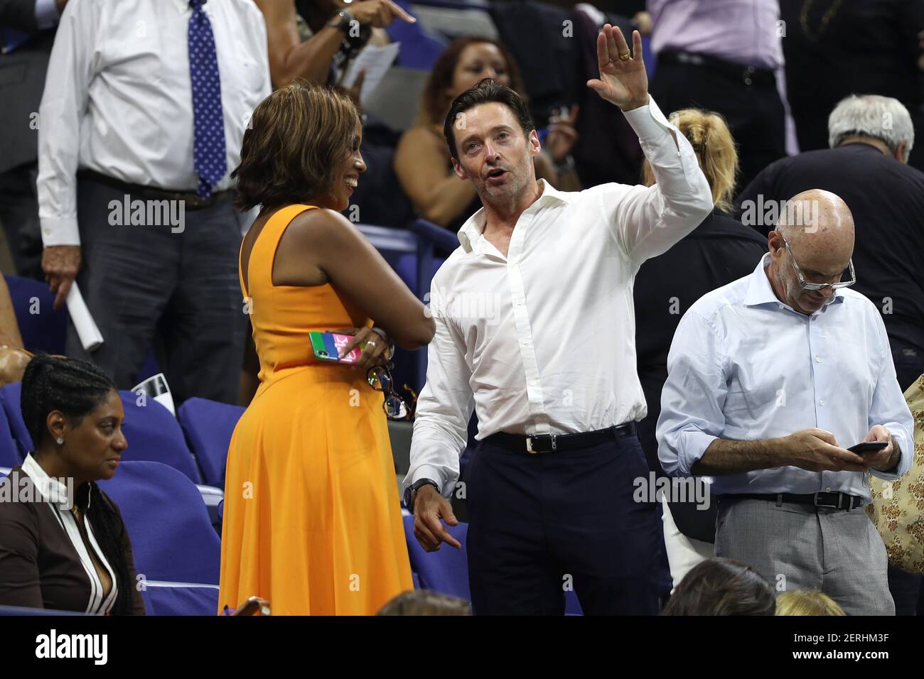 Actor Hugh Jackman (center) speaks with Gayle King (left - orange dress ...