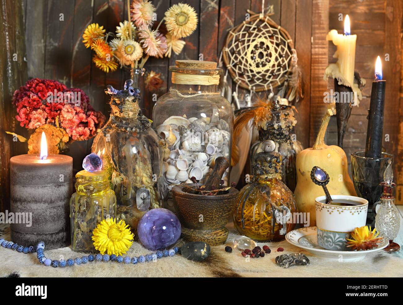 Still life with potion and elixir bottles, burning candles and magic ...
