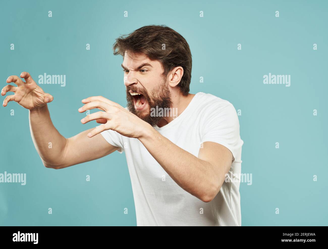 Aggressive man emotions and stress irritability blue background Stock ...