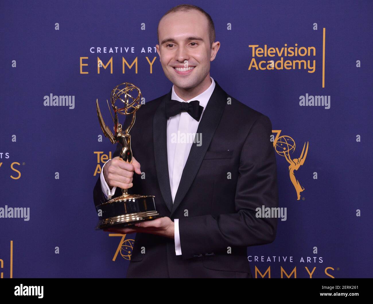 Charlie Redd poses in the press room after accepting the award for ...