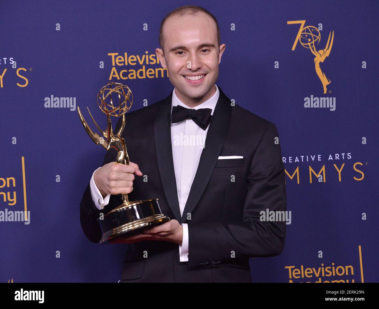 Charlie Redd poses in the press room after accepting the award for ...