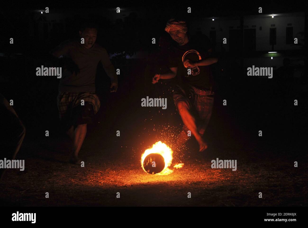 Indonesian Muslims seen playing a soccer game using a fireball made ...