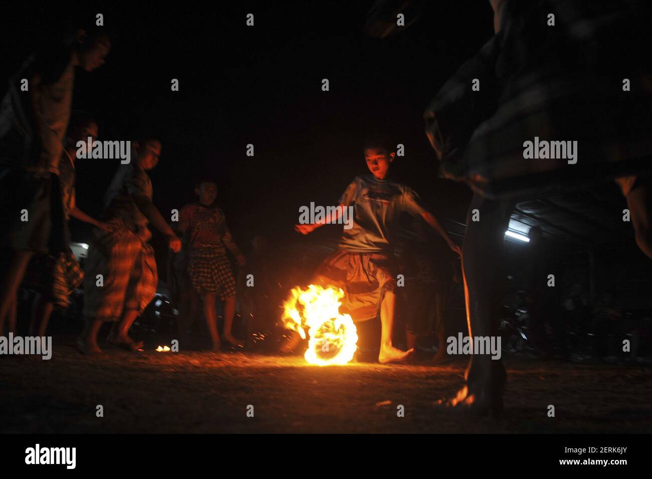 Indonesian Muslims seen playing a soccer game using a fireball made ...