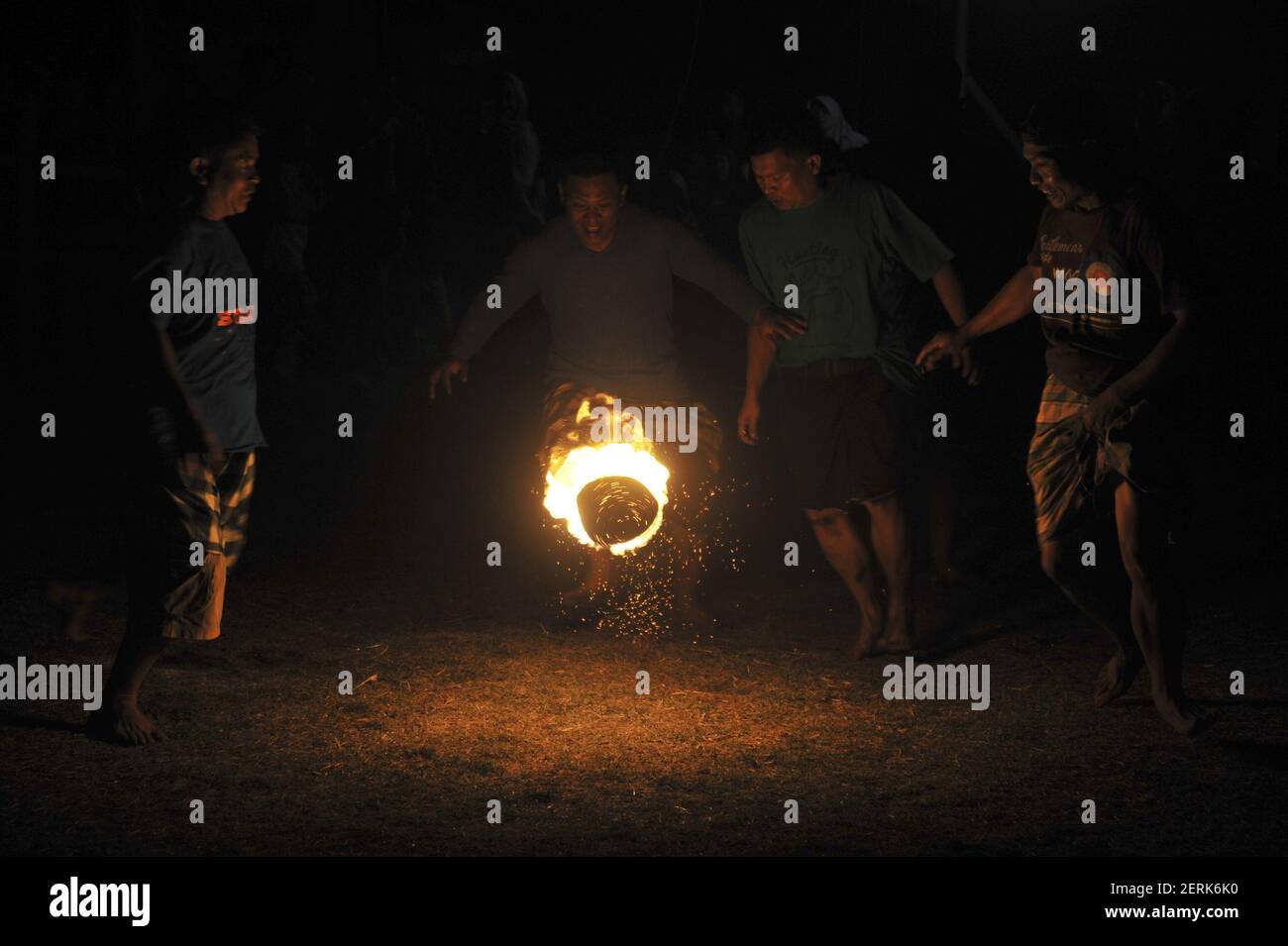 Indonesian Muslims seen playing a soccer game using a fireball made ...