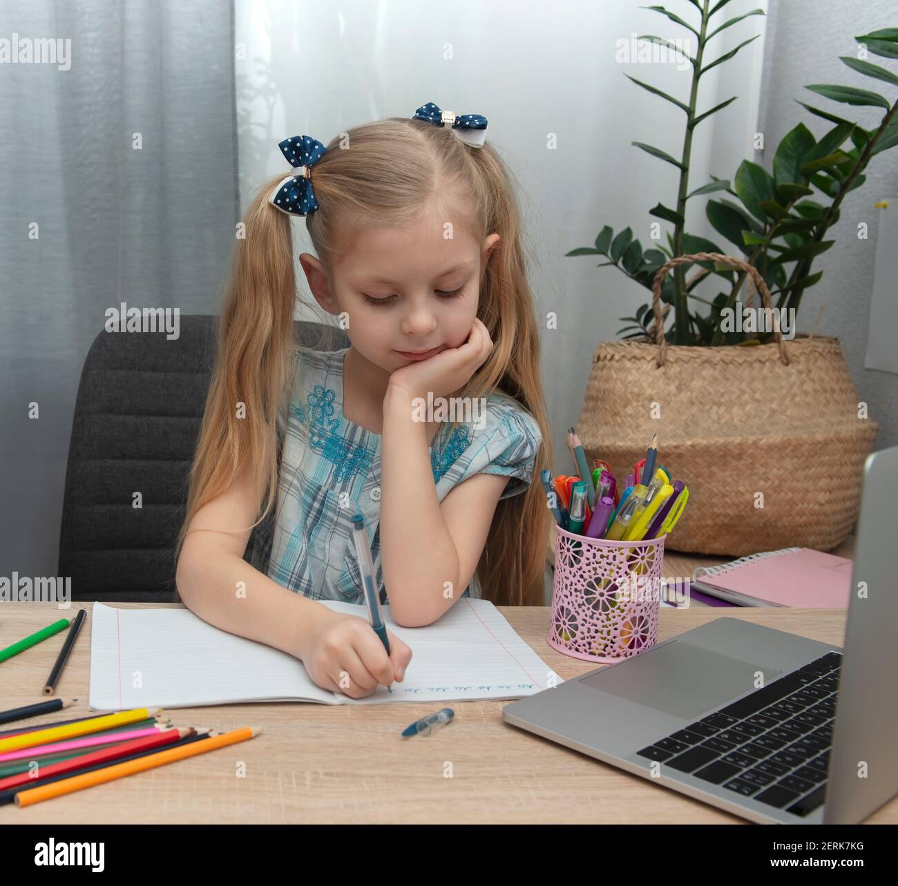 Cute girl doing homework in her room at home Stock Photo - Alamy