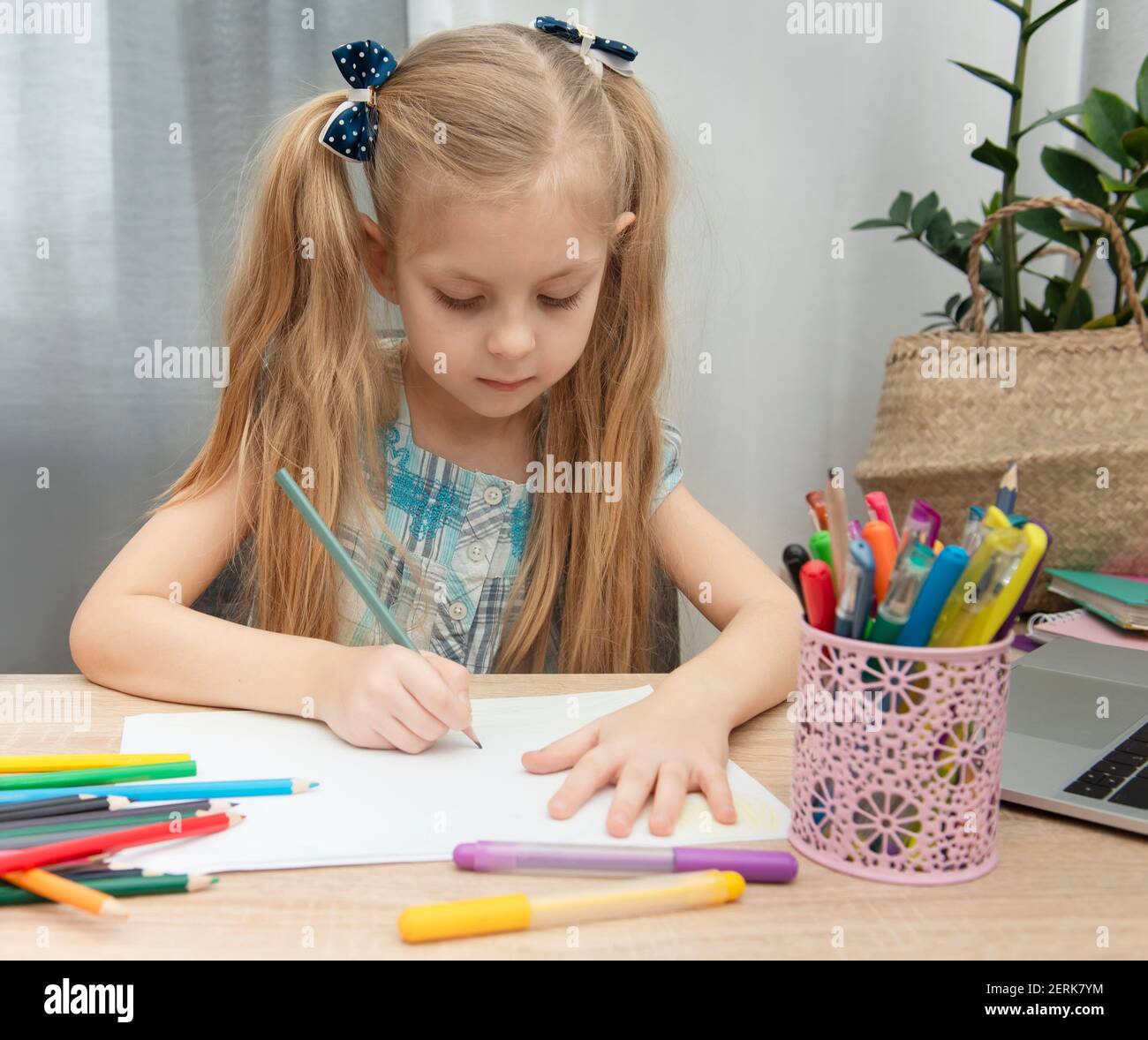 Cute girl doing homework in her room at home Stock Photo - Alamy