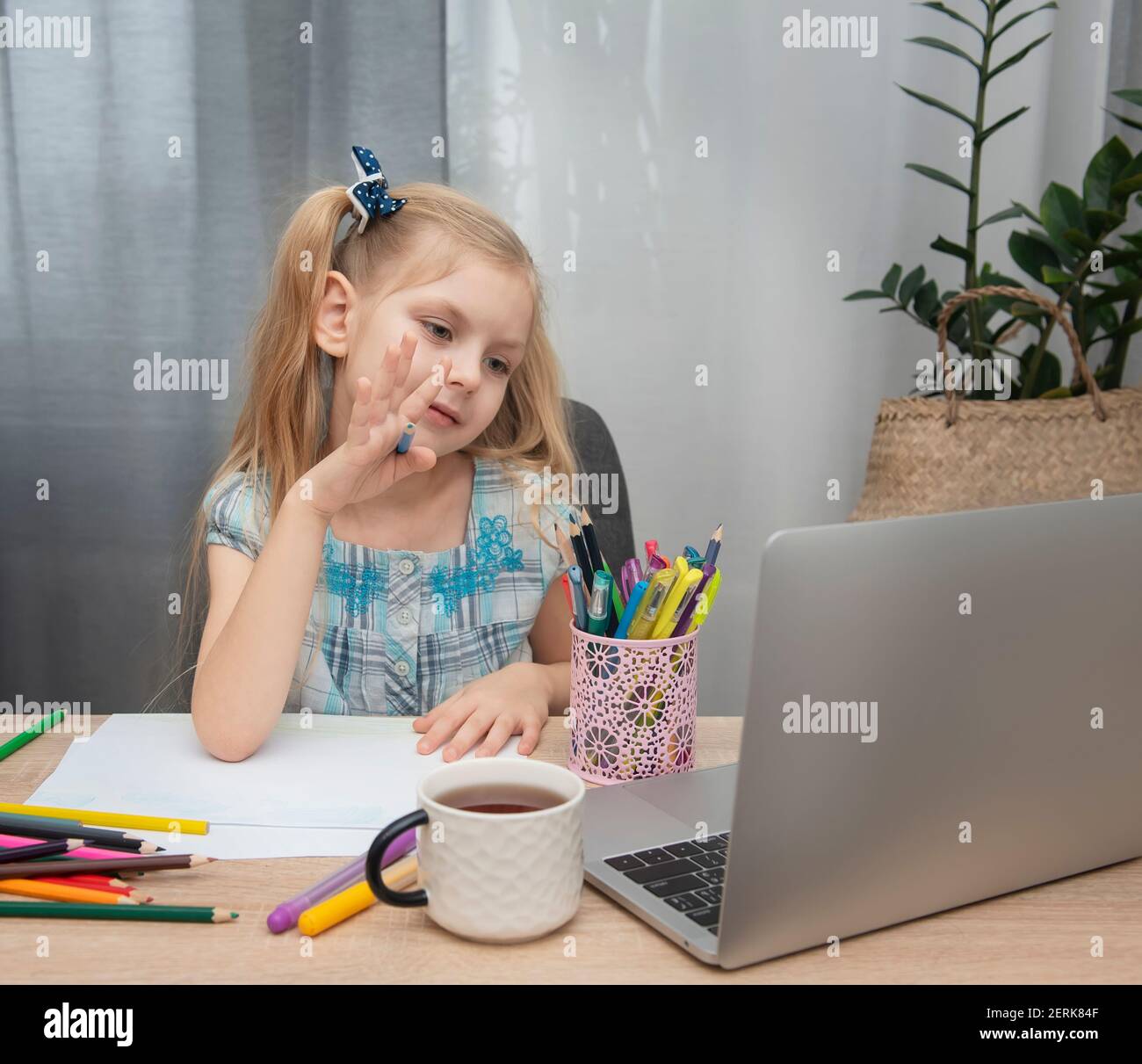 Cute girl doing homework in her room at home Stock Photo - Alamy