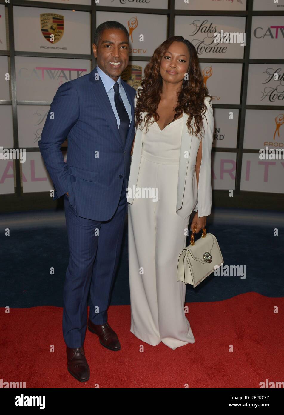 MIAMI BEACH, FL - SEPTEMBER 09: Calvin Hughes and Garcelle Beauvais ...