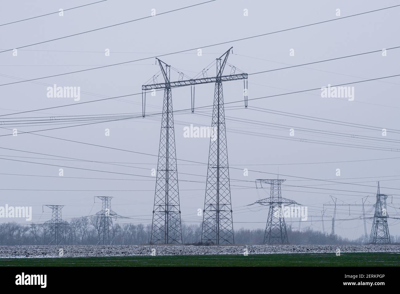 Power transmission lines. Winter landscape with high voltage power ...