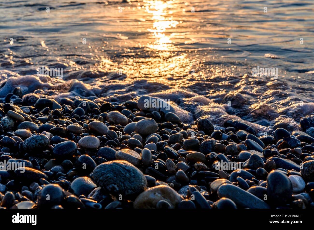 Round stones on beach sunrise hi-res stock photography and images - Alamy