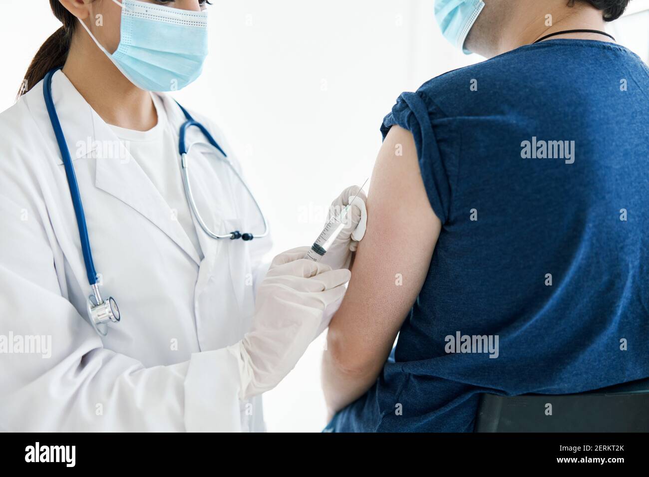 woman doctor giving an injection in the shoulder Patient laboratory ...