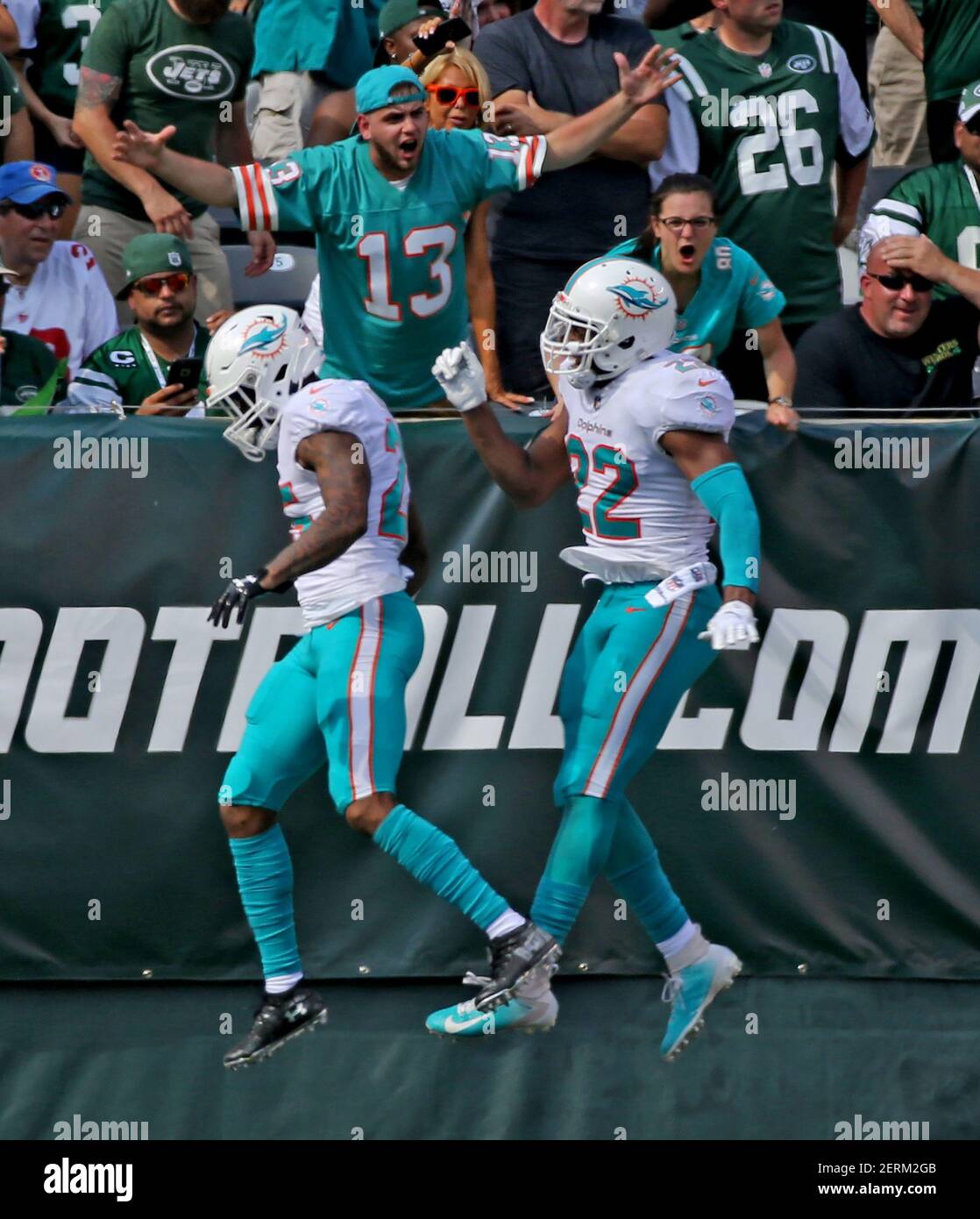 Miami Dolphins fans celebrate with Xavien Howard (25) and T.J. McDonald ...