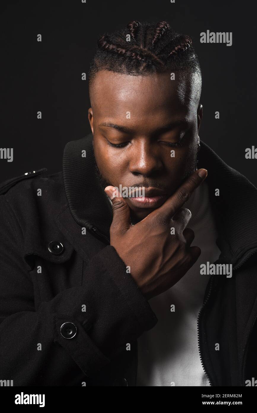 Pensive black man. Close up. Black background Stock Photo - Alamy Pensive black man. Close up. Black background Stock Photo - Alamy
