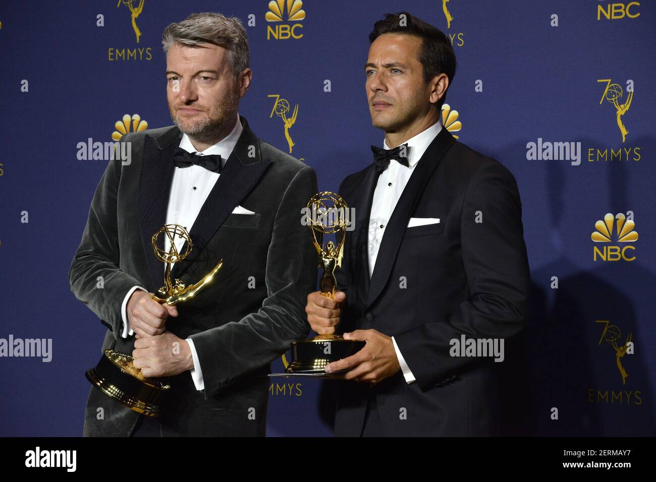 Charlie Brooker, and William Bridges pose backstage with the award for ...