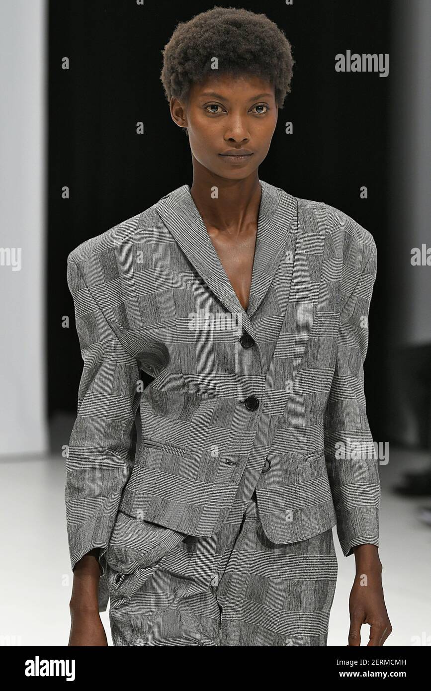 Model Mame Camara walks on the runway during the Chalayan London ...