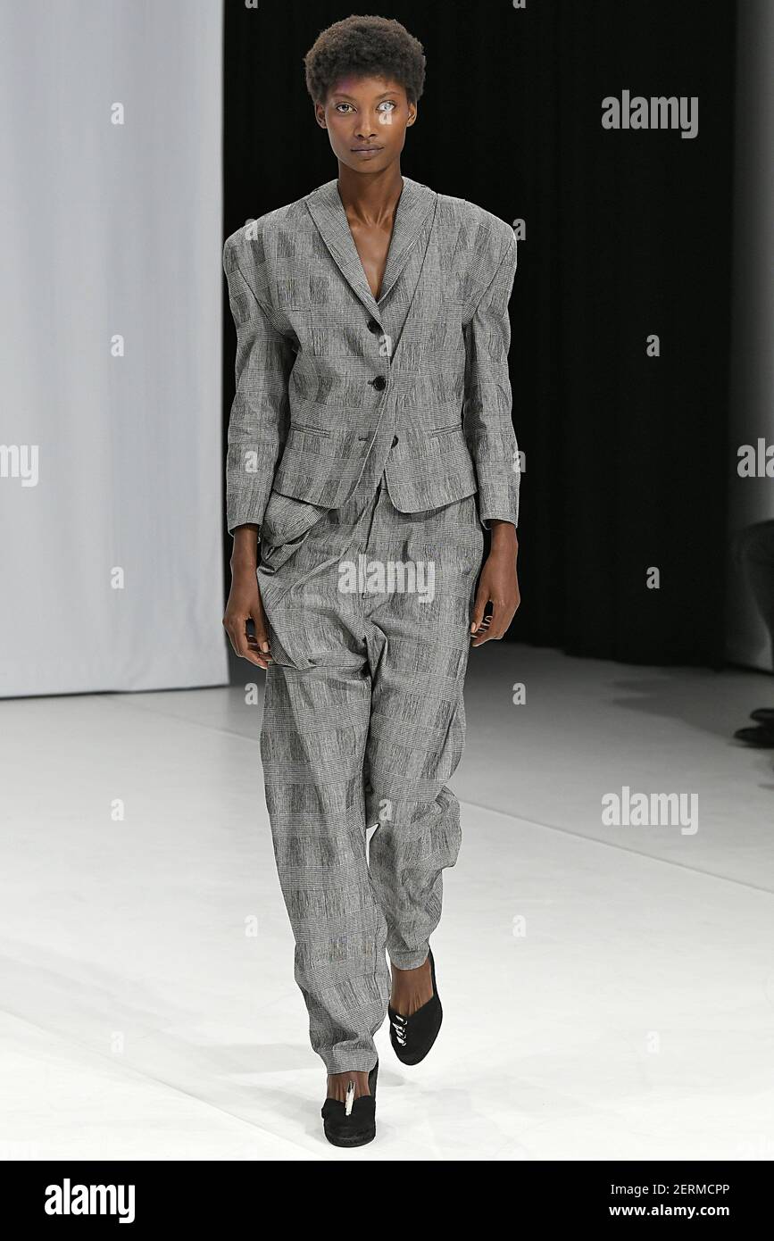 Model Mame Camara walks on the runway during the Chalayan London ...