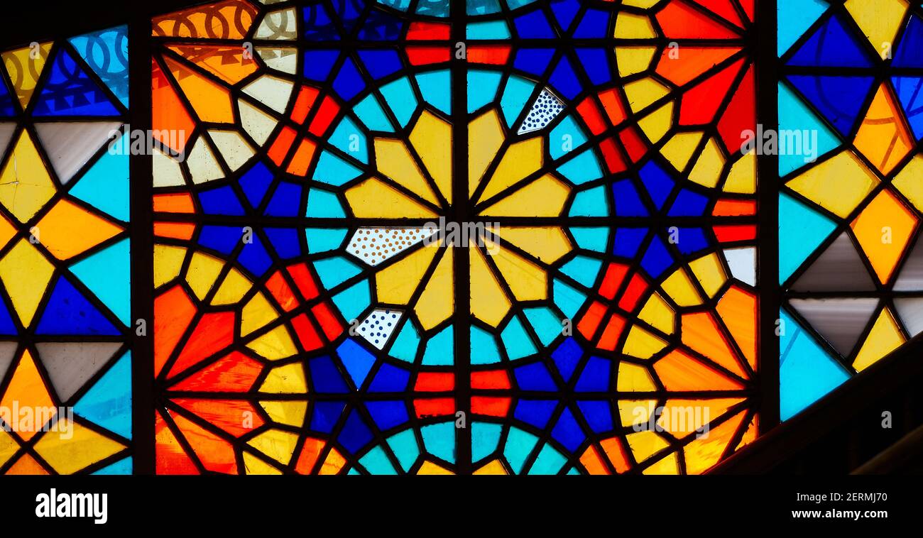 Colorful stained glass window. Bright geometric shapes Stock Photo - Alamy
