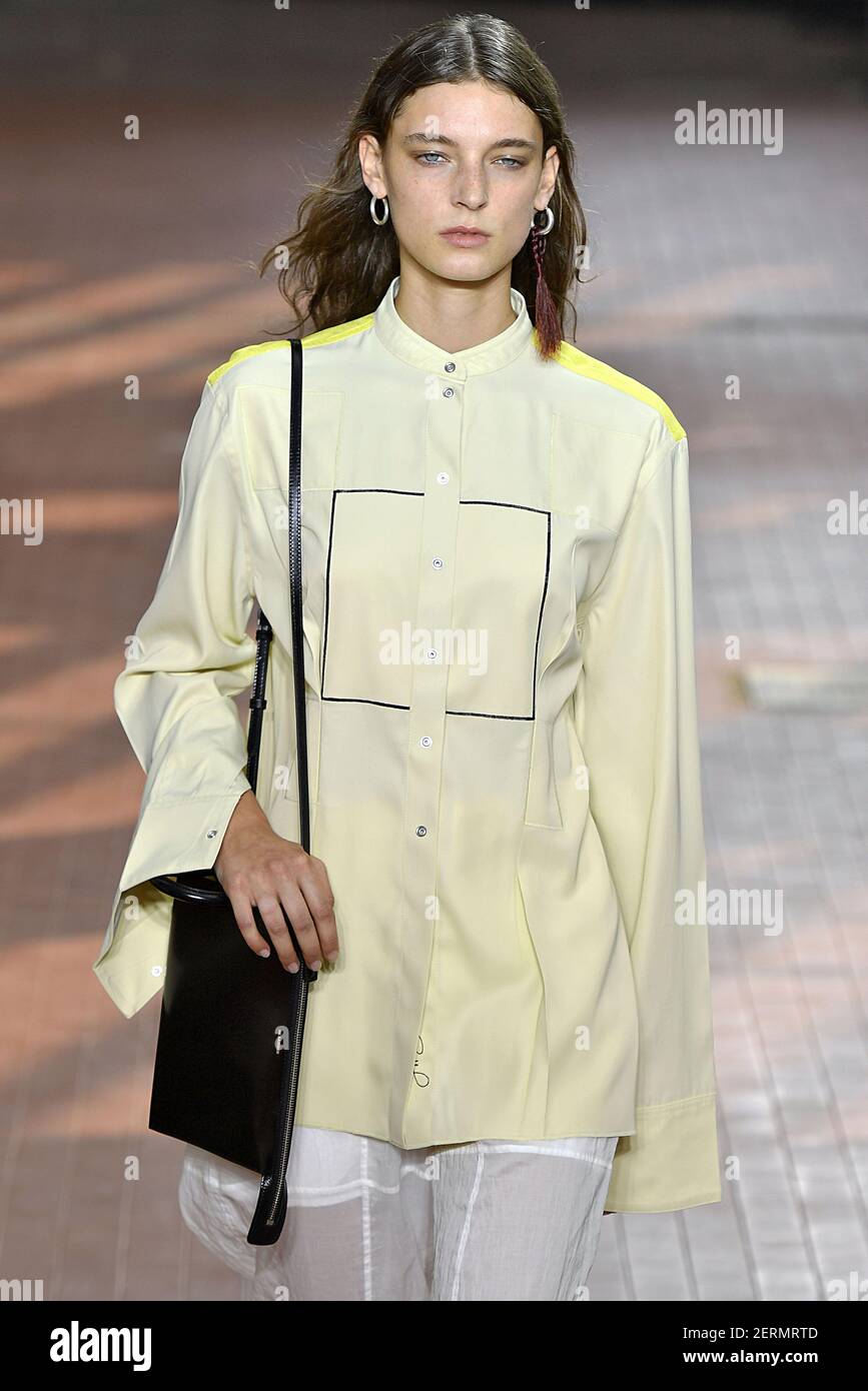 Model Ansley Gulielmi walks on the runway during the Jil Sander Fashion ...