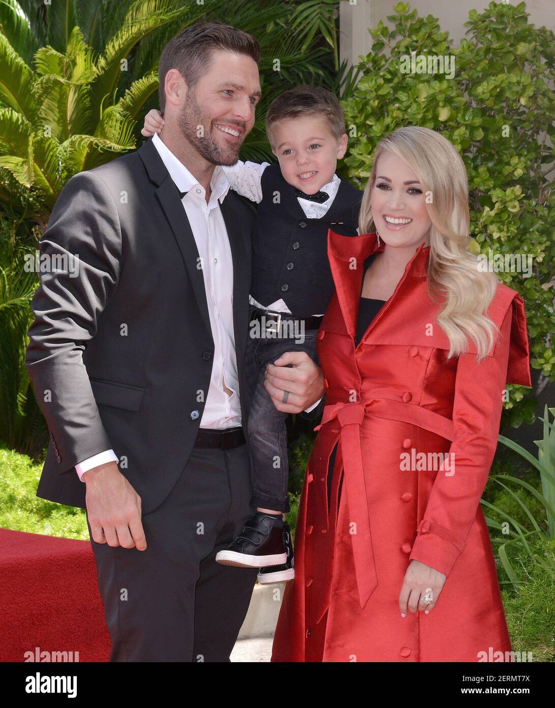 (L-R) Mike Fisher, Isaiah Michael Fisher and Carrie Underwood at the ...