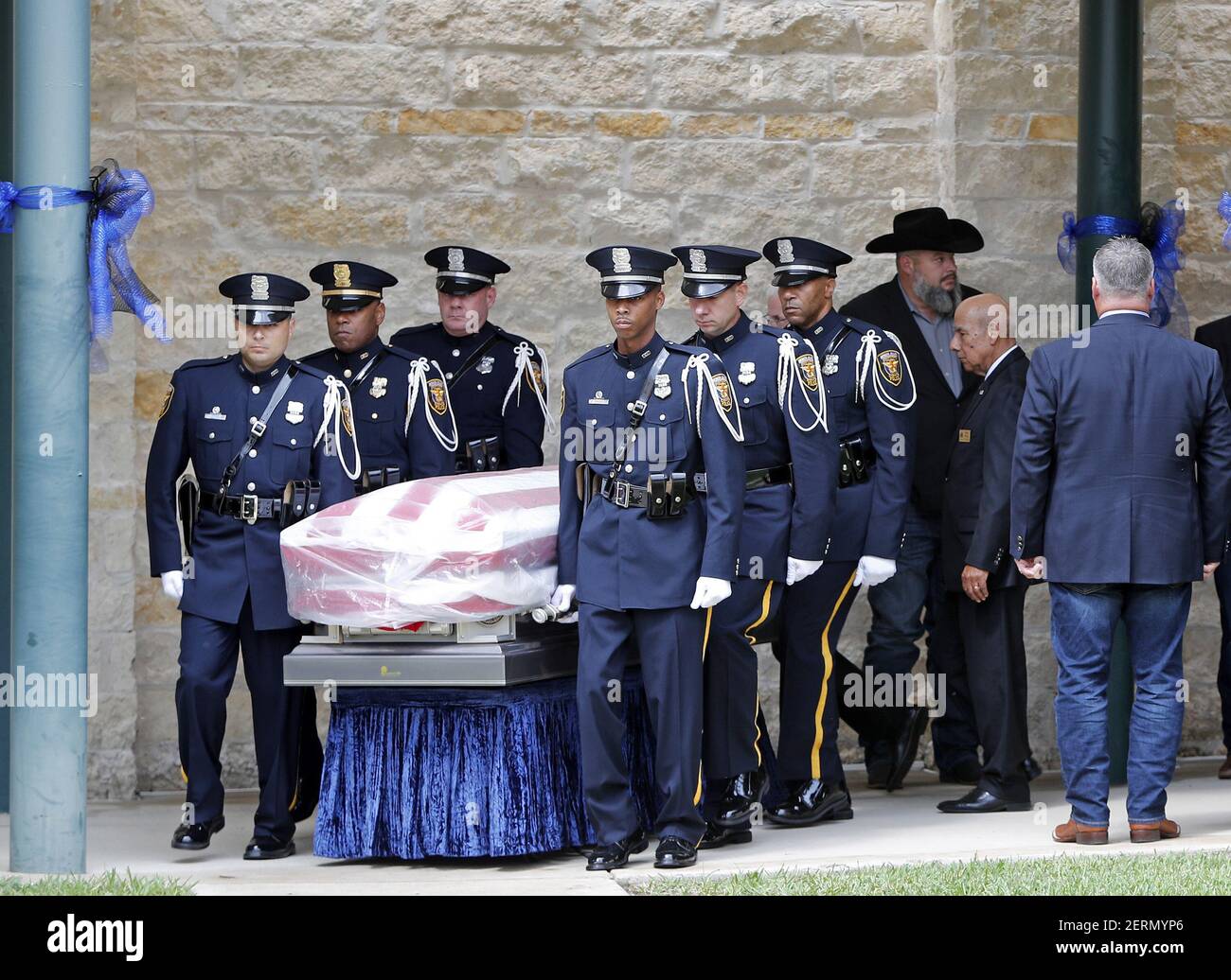 The casket of Fort Worth, Texas, police officer Garrett Hull is carried ...