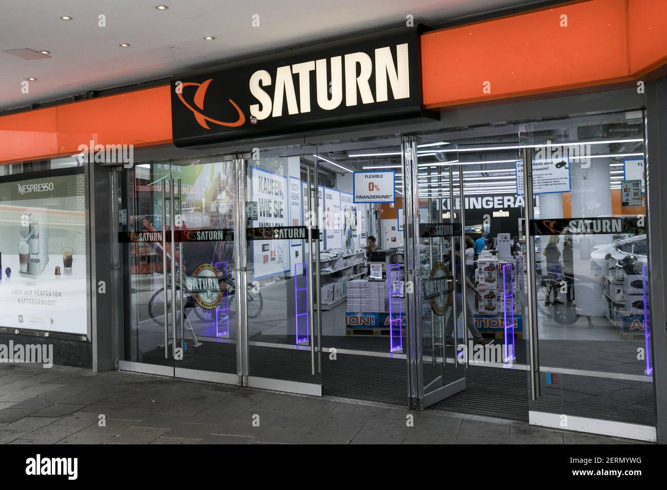 A logo sign outside of a Saturn retail store in Munich, Germany, on ...