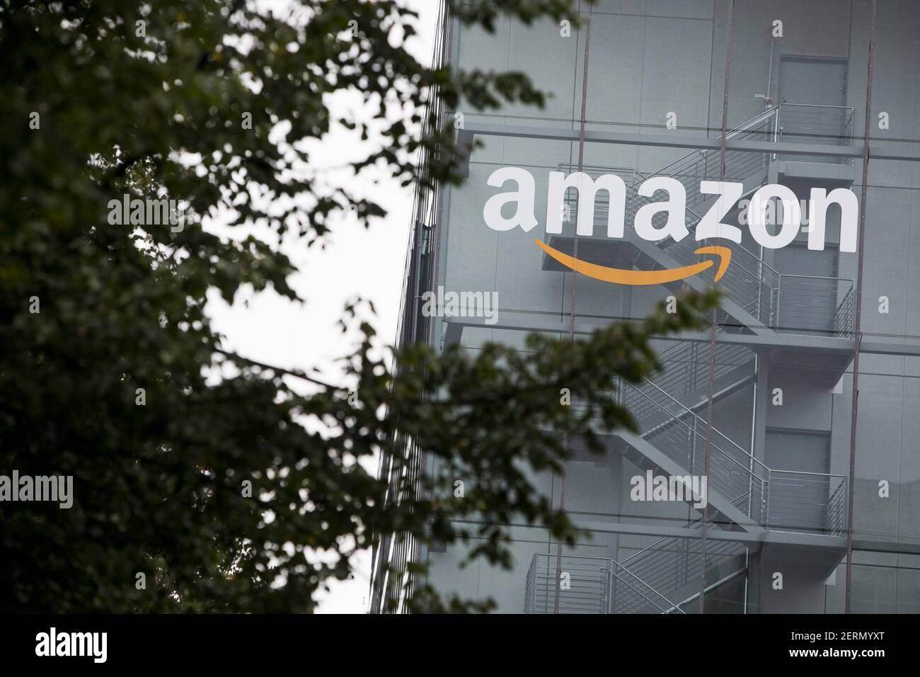 A logo sign outside of a facility occupied by Amazon in Munich, Germany ...