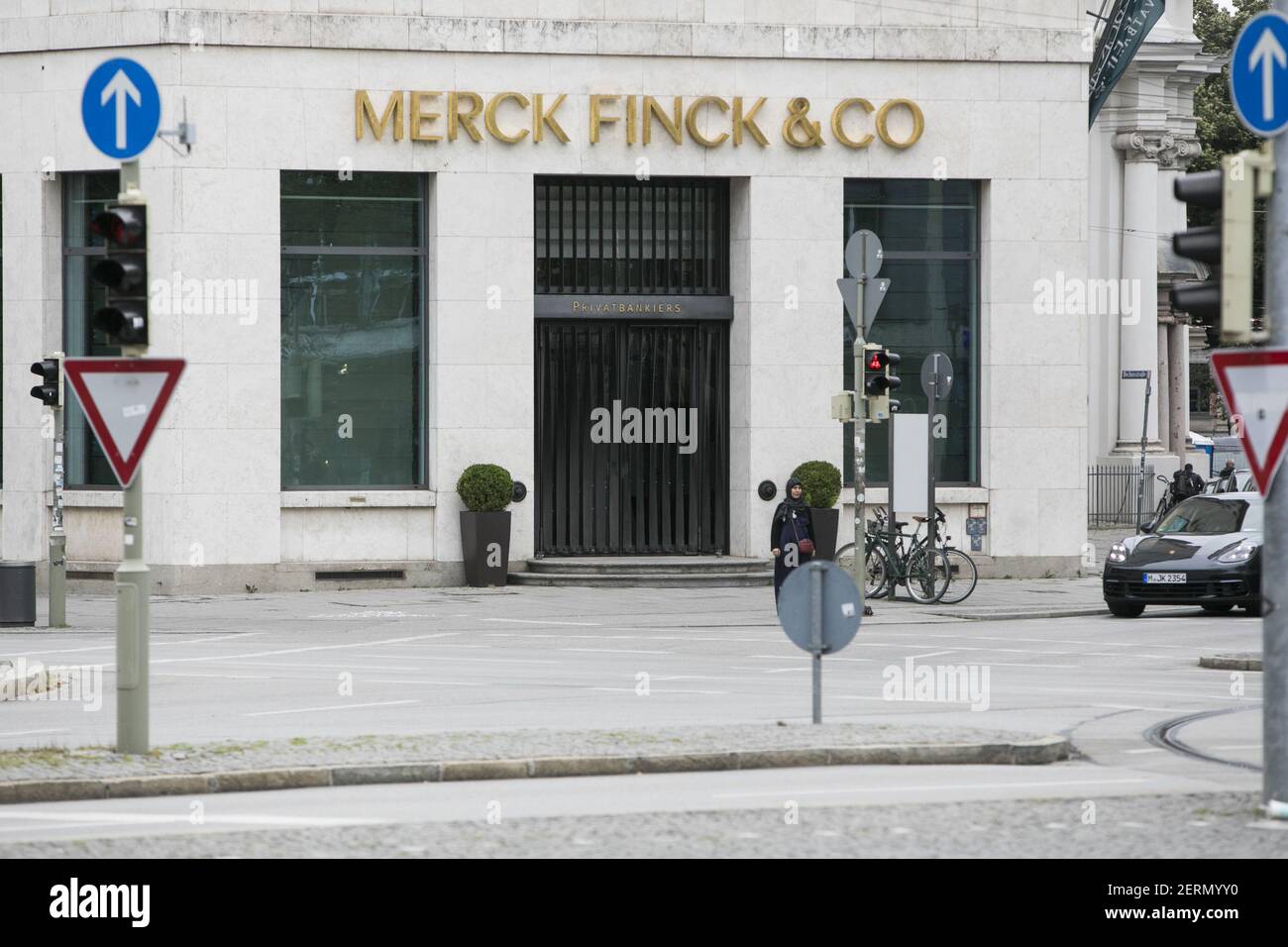 A logo sign outside of the headquarters of Merck Finck & Co., in Munich ...