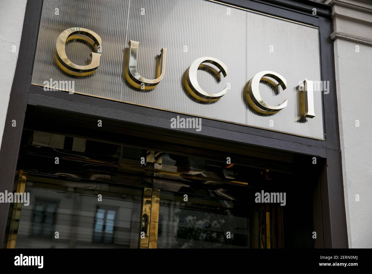 A logo sign outside of a Gucci retail store in Munich, Germany, on ...