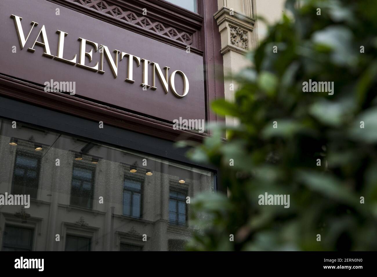 A logo sign outside of a Valentino retail store in Munich, Germany, on ...