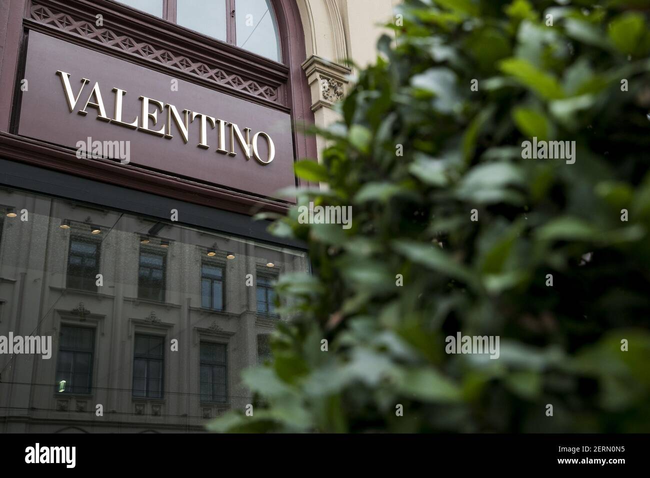 A logo sign outside of a Valentino retail store in Munich, Germany, on ...