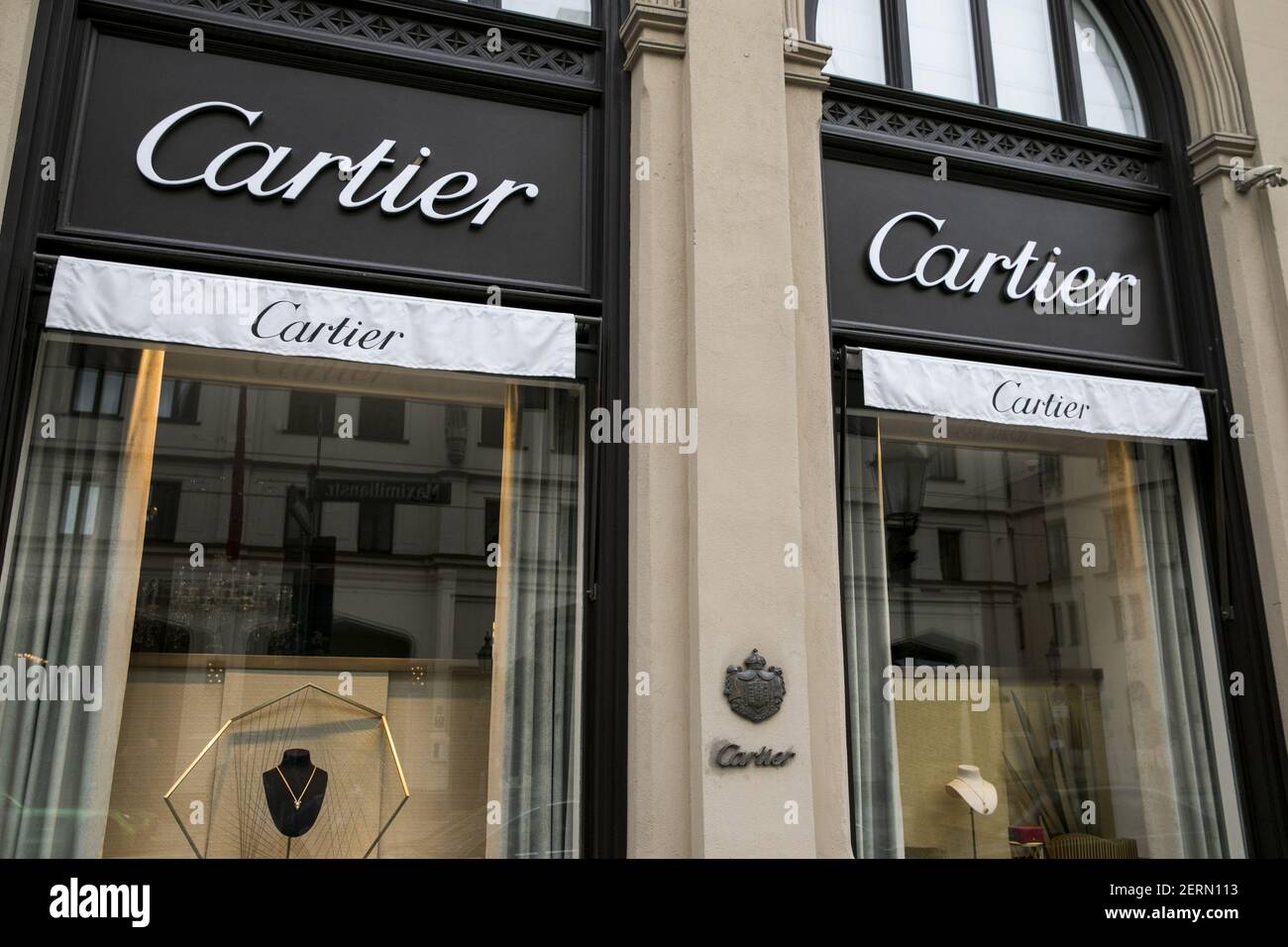 A logo sign outside of a Cartier retail store in Munich, Germany, on ...