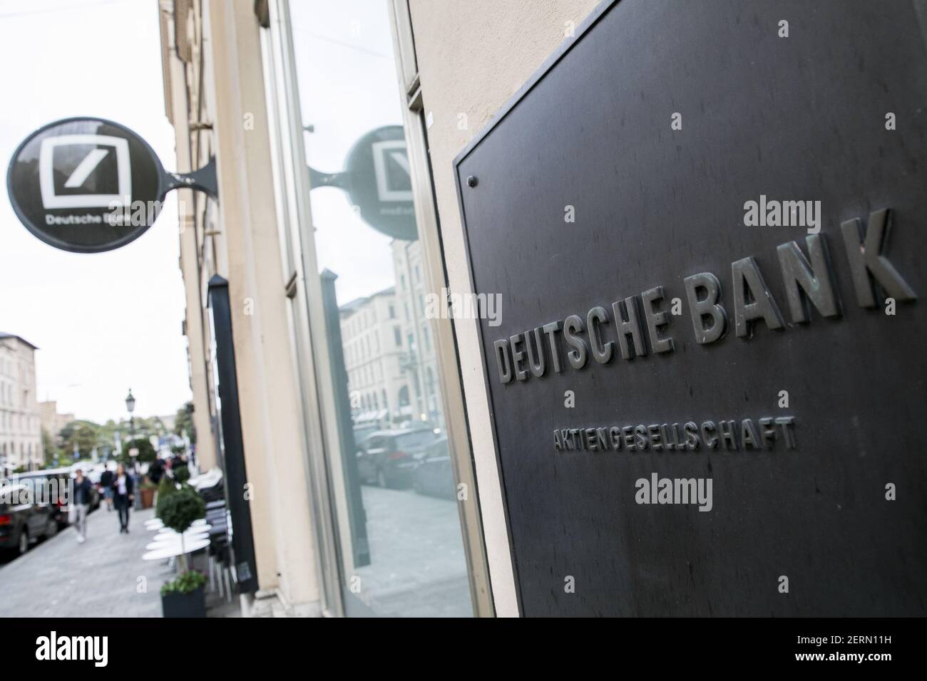 A logo sign outside of a Deutsche Bank branch in Munich, Germany, on ...