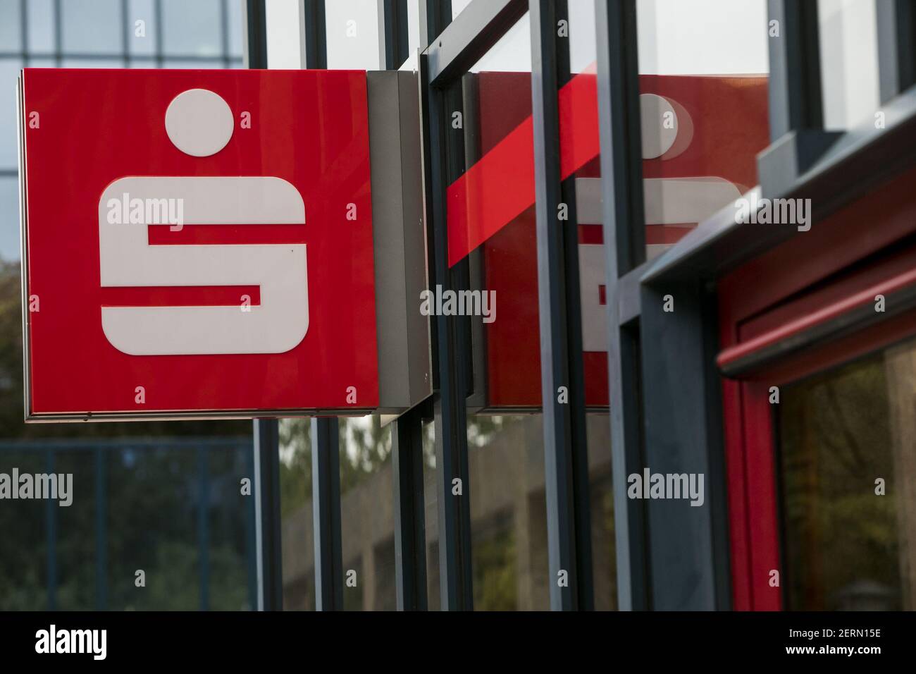 A logo sign outside of the headquarters of Stadtsparkasse München in ...